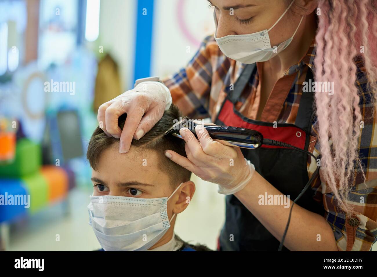 Teenager boy wearing face mask at barber shop during pandemic Stock ...