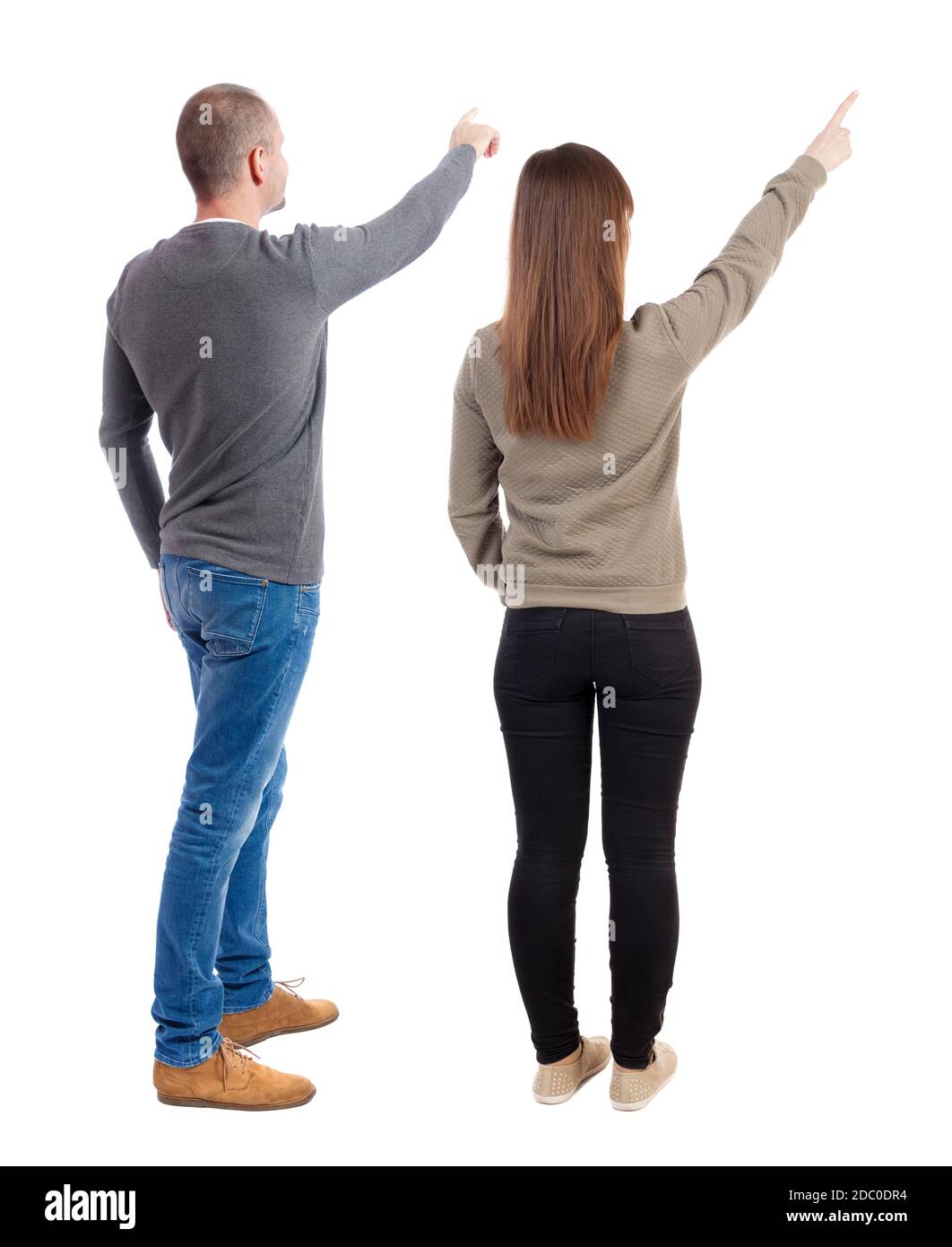 Back view of couple in sweater pointing. Rear view people collection ...