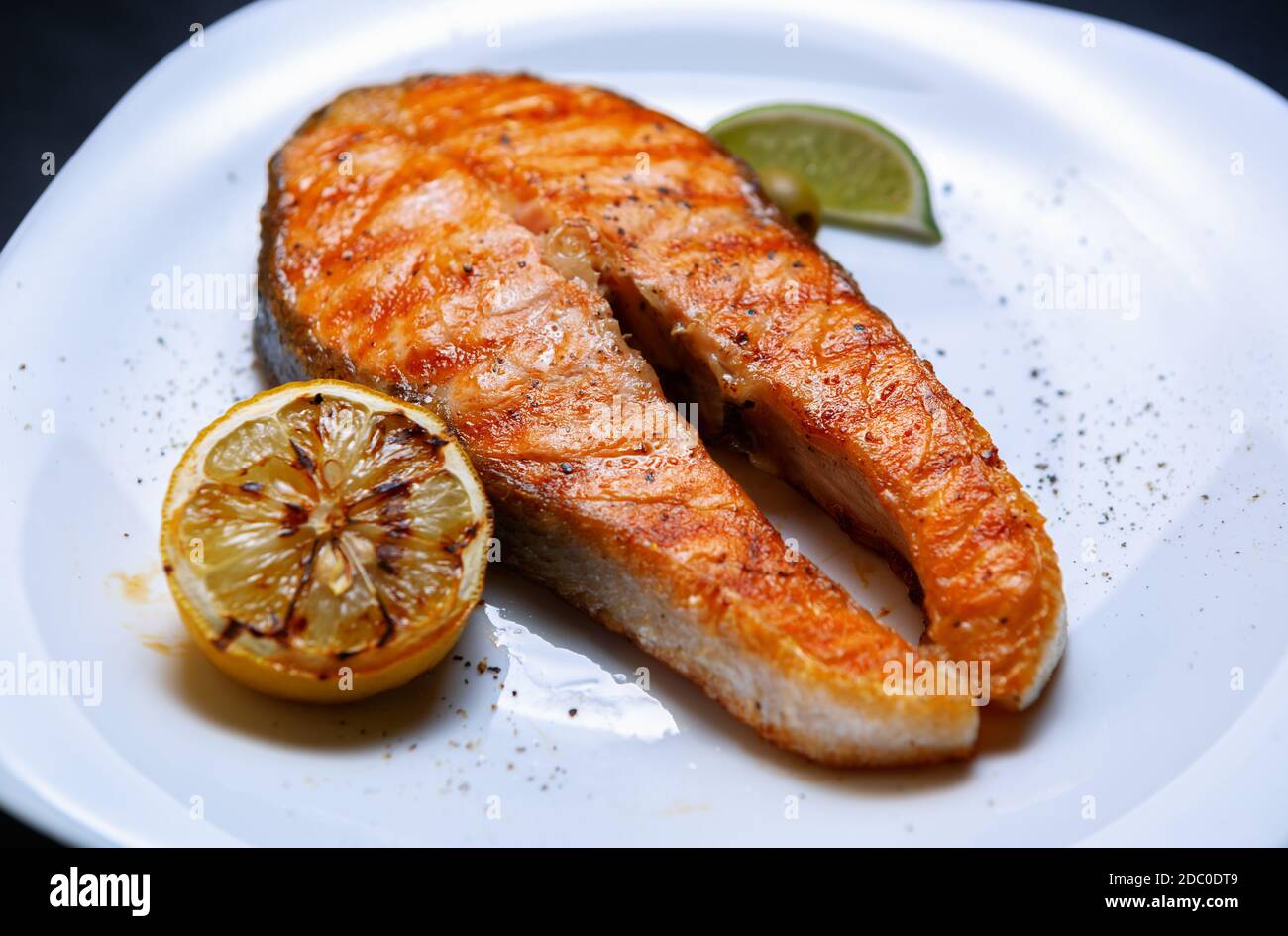 Salmon fish steak grilled for dinner.Delicious piece of red fish fillet ...