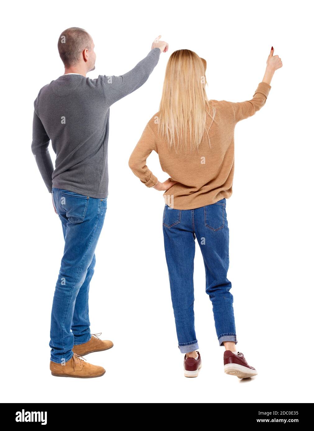 Back view of couple in sweater pointing. Rear view people collection ...