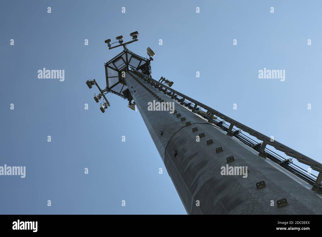 bottom view of a metal pylon with cell phone antennas Stock Photo - Alamy