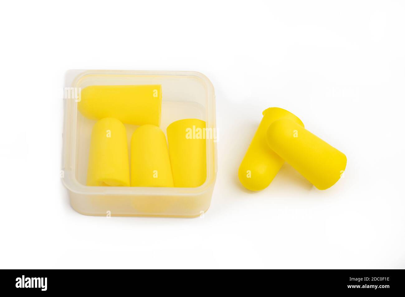 Yellow Ear plugs isolated on a white background Stock Photo - Alamy