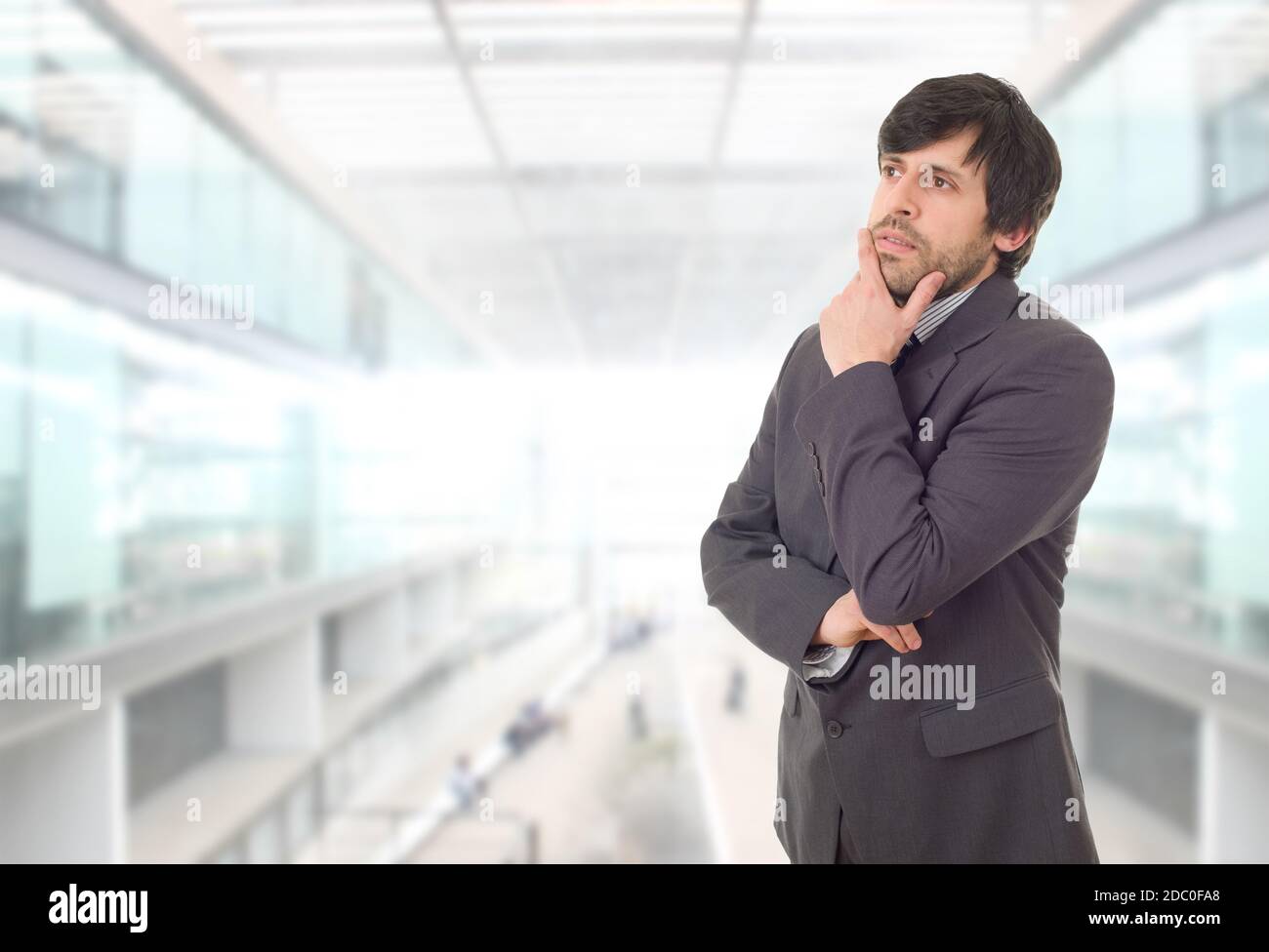 young business man thinking, at the office Stock Photo - Alamy
