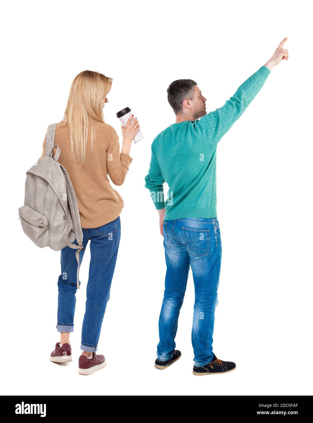 Back view of couple in sweater pointing. Rear view people collection ...