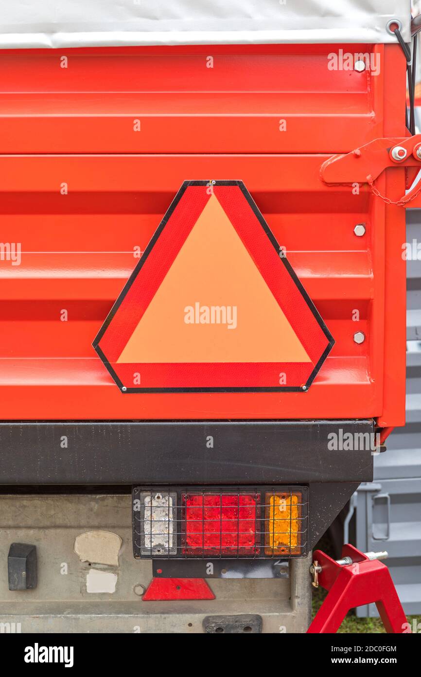 Red Safety Triangle at Agriculture Trailer Stock Photo - Alamy