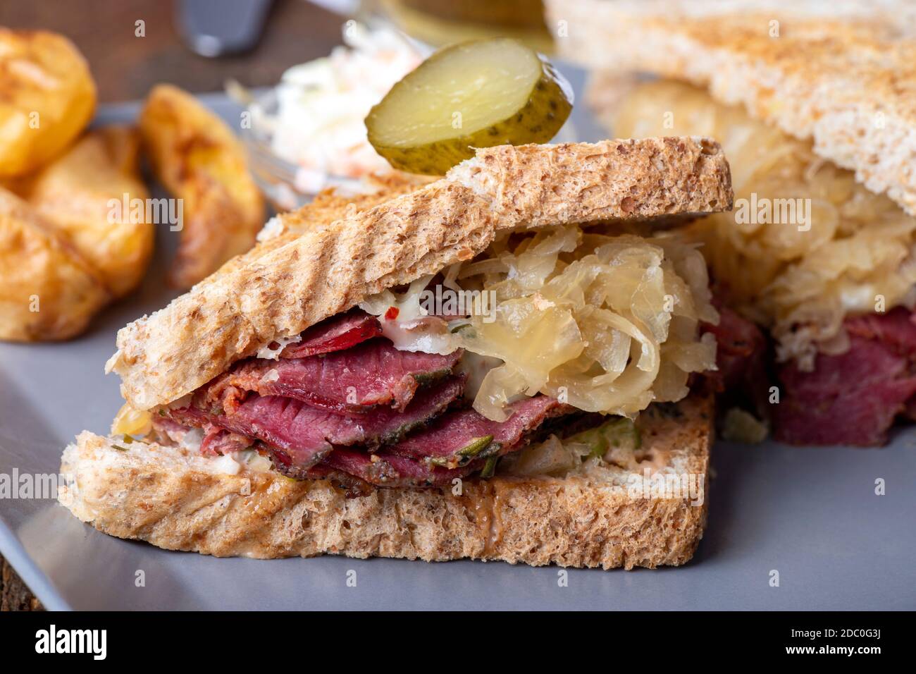 reuben sandwich on a plate with fries Stock Photo - Alamy