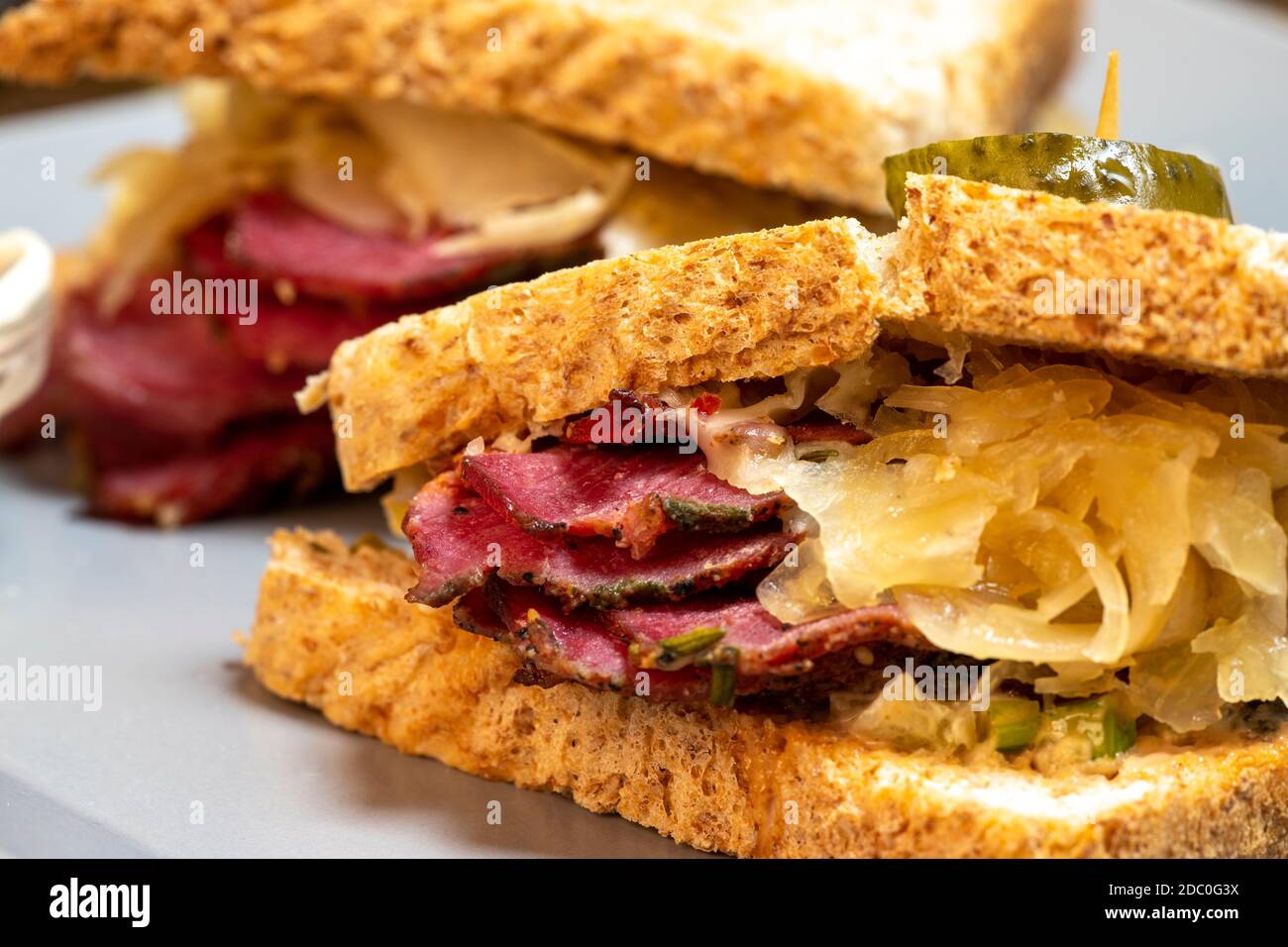 reuben sandwich on a plate with fries Stock Photo - Alamy