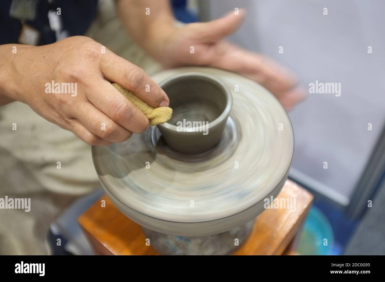 Concept Ceramic workshop. The man Throwing clay bowl on a pottery's ...