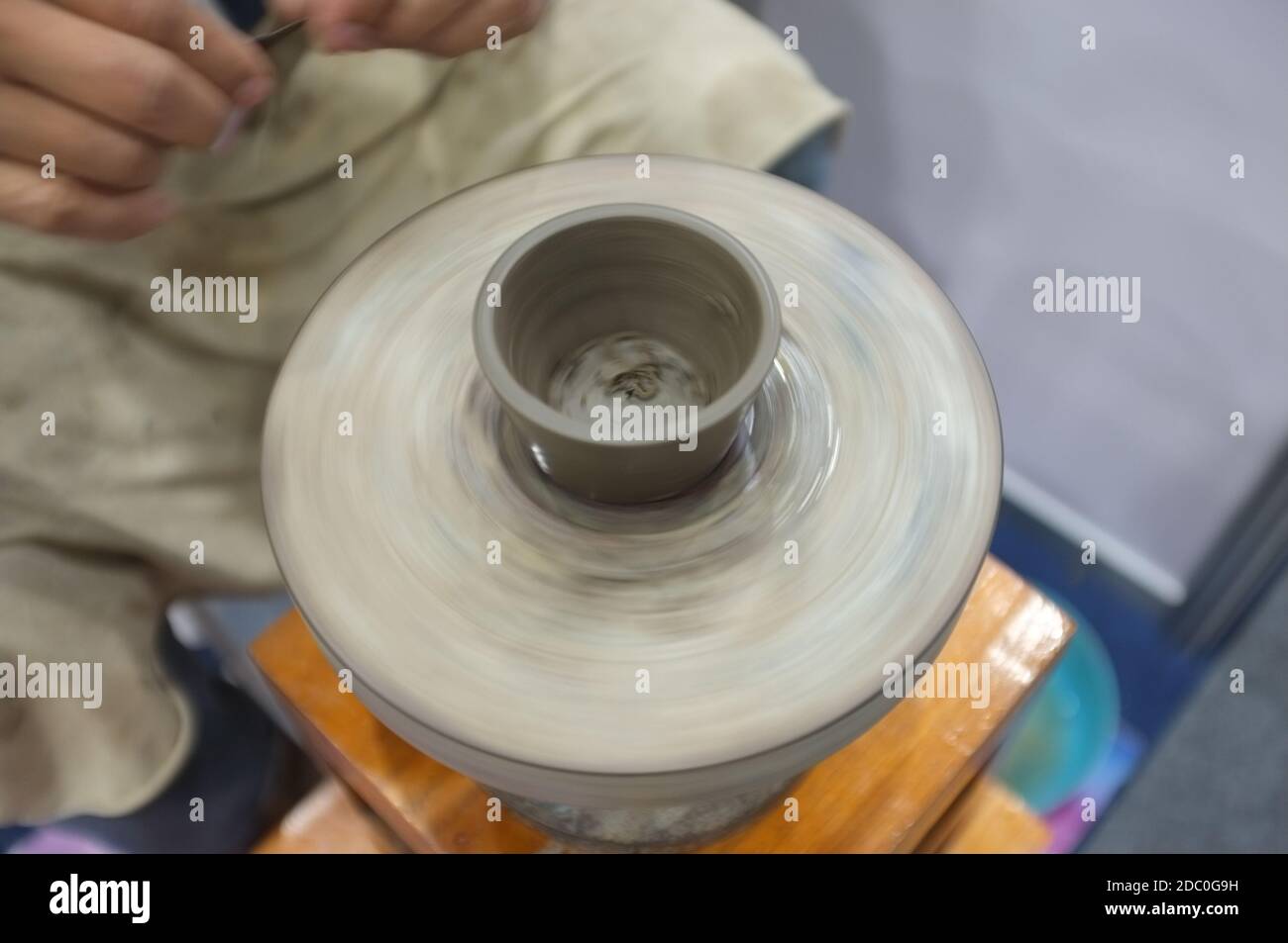 Concept Ceramic workshop. The man Throwing clay bowl on a pottery's ...