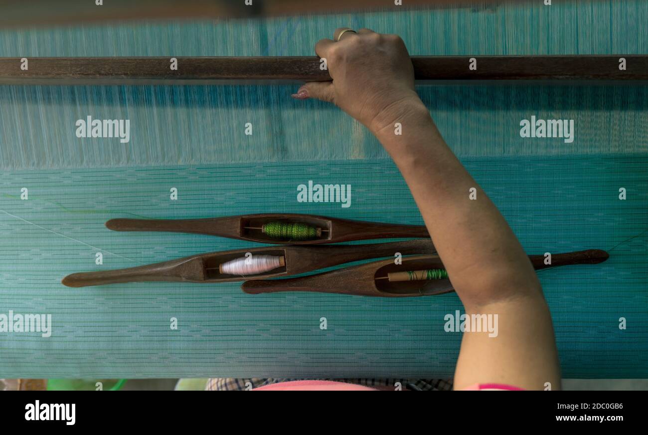 Woman working on weaving machine for weave handmade fabric. Textile ...