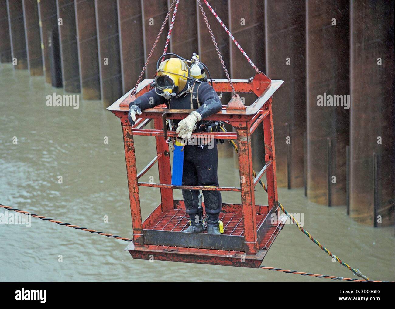 Diver in a man riding cage hi-res stock photography and images - Alamy