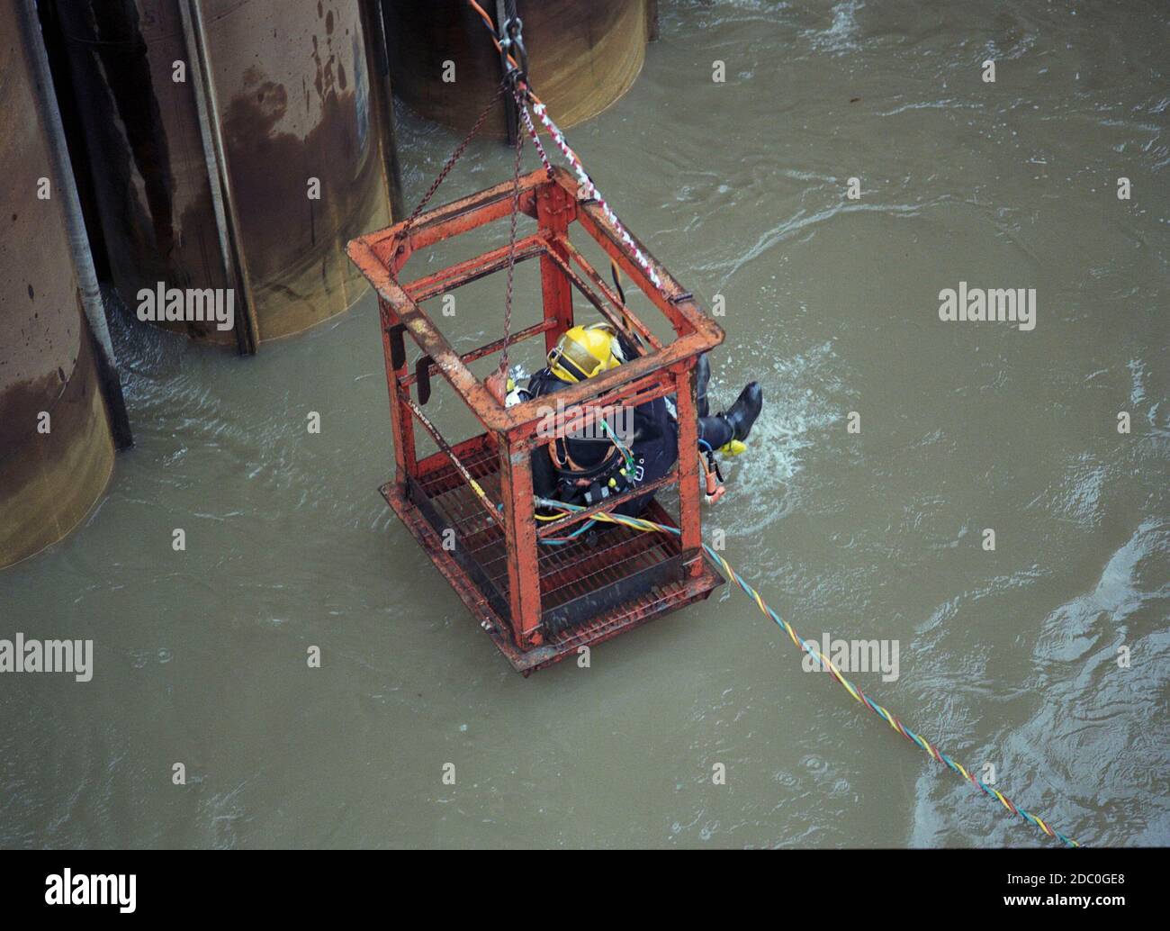 Diver in a man riding cage hi-res stock photography and images - Alamy