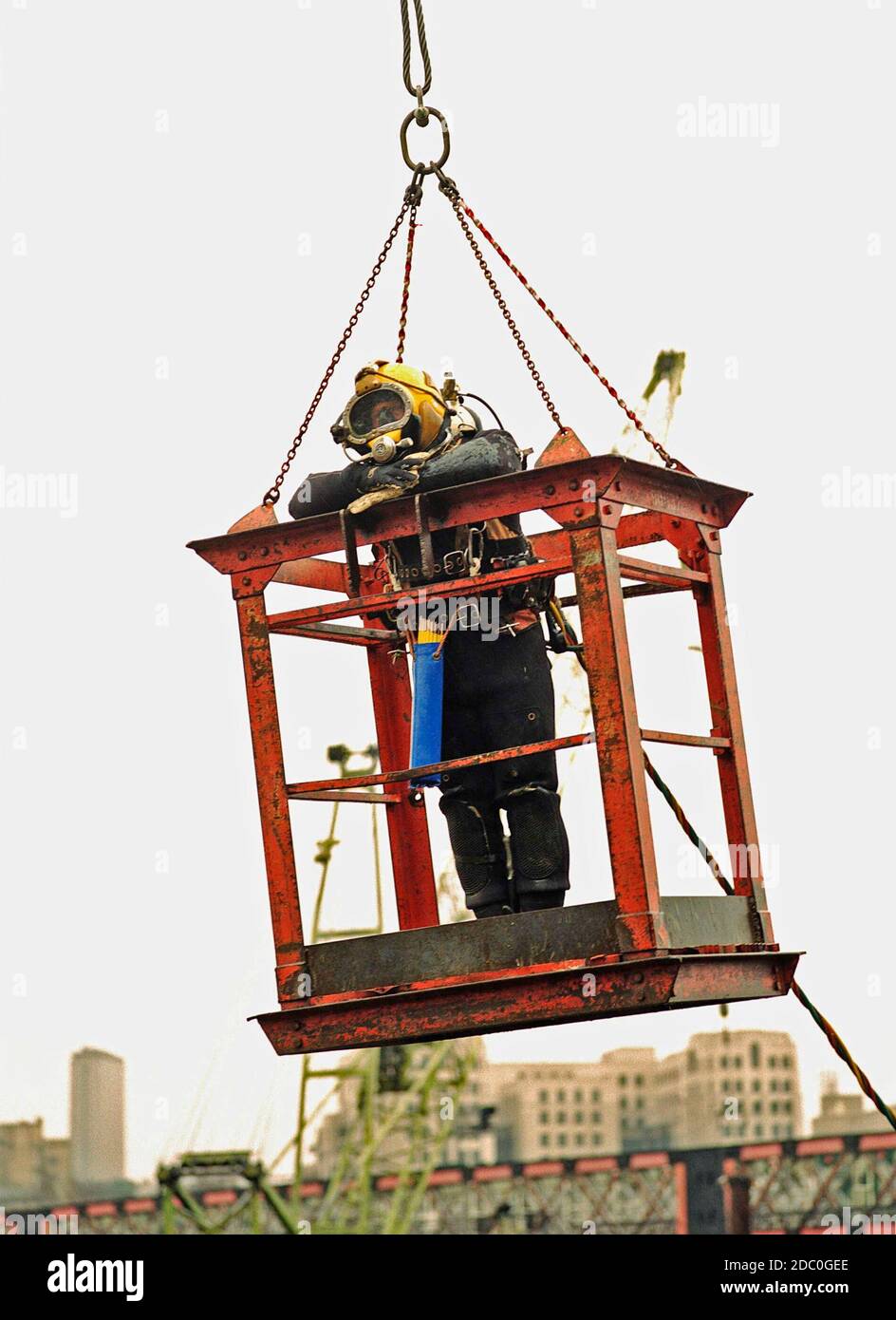 Diver in a man riding cage hi-res stock photography and images - Alamy