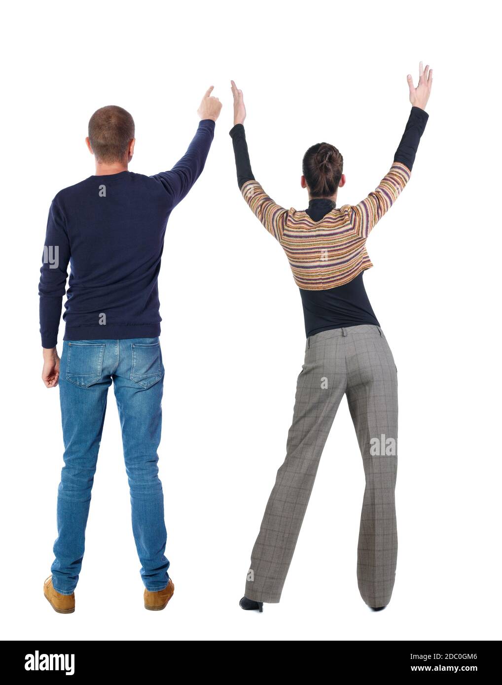 Back view of couple in sweater pointing. Rear view people collection ...