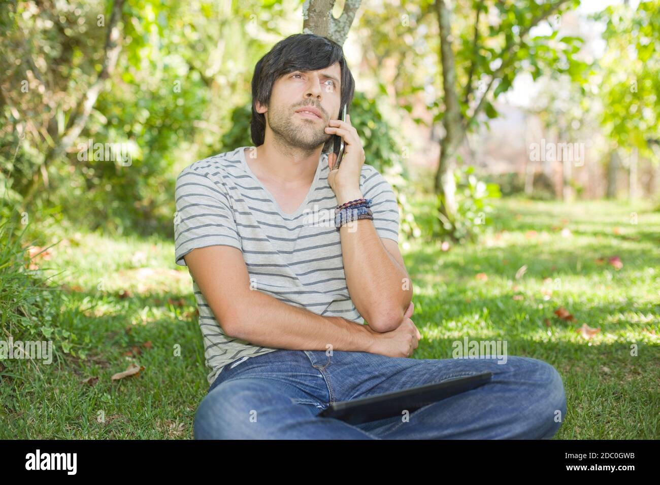 young casual man on the phone, outdoor Stock Photo - Alamy