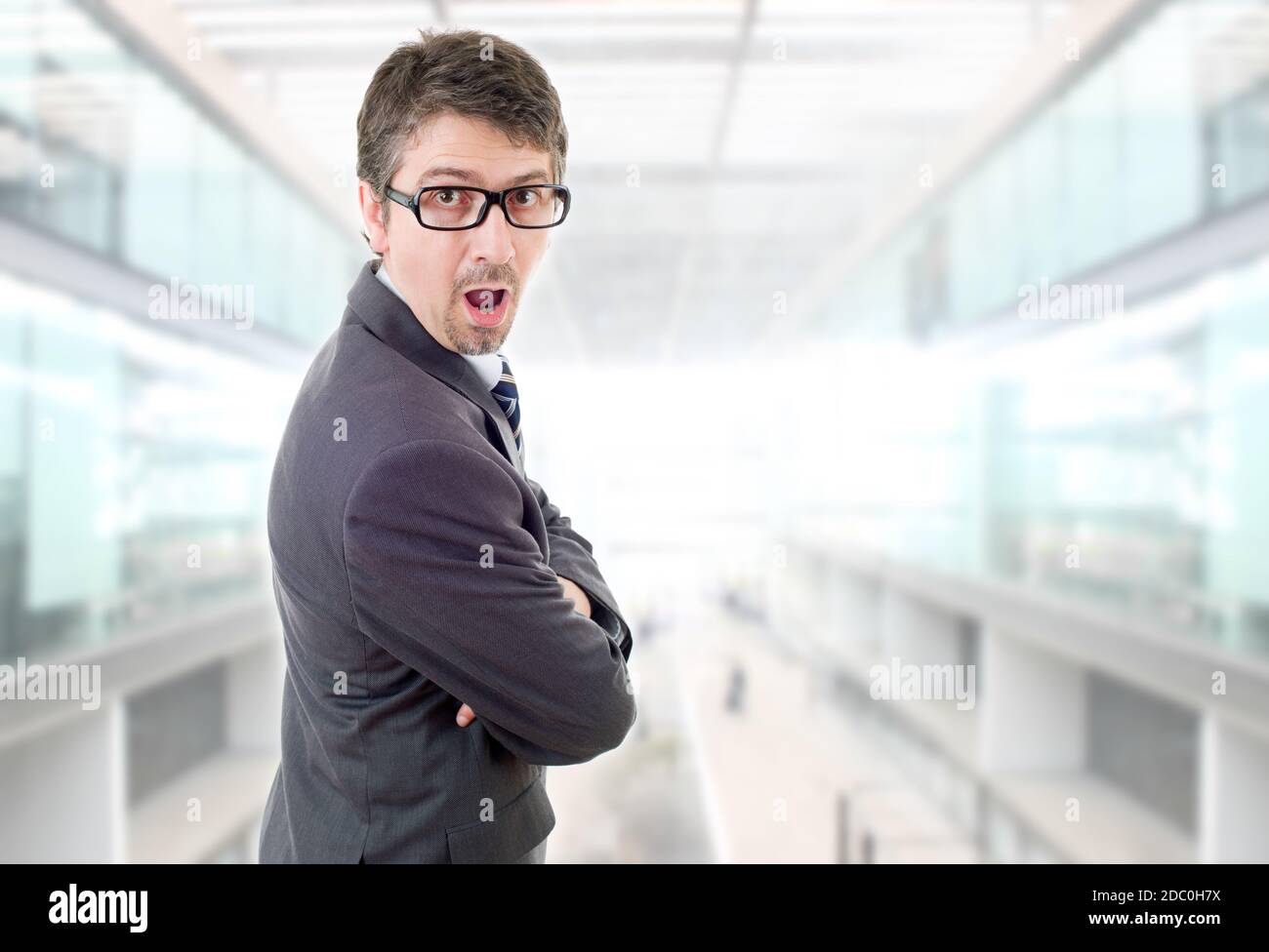 silly business man surprised at the office Stock Photo - Alamy
