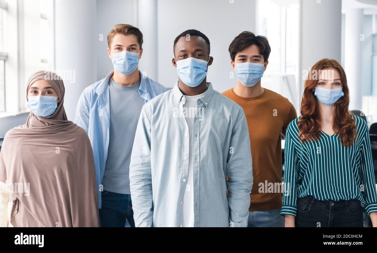 Diverse group of international people wearing face masks Stock Photo ...