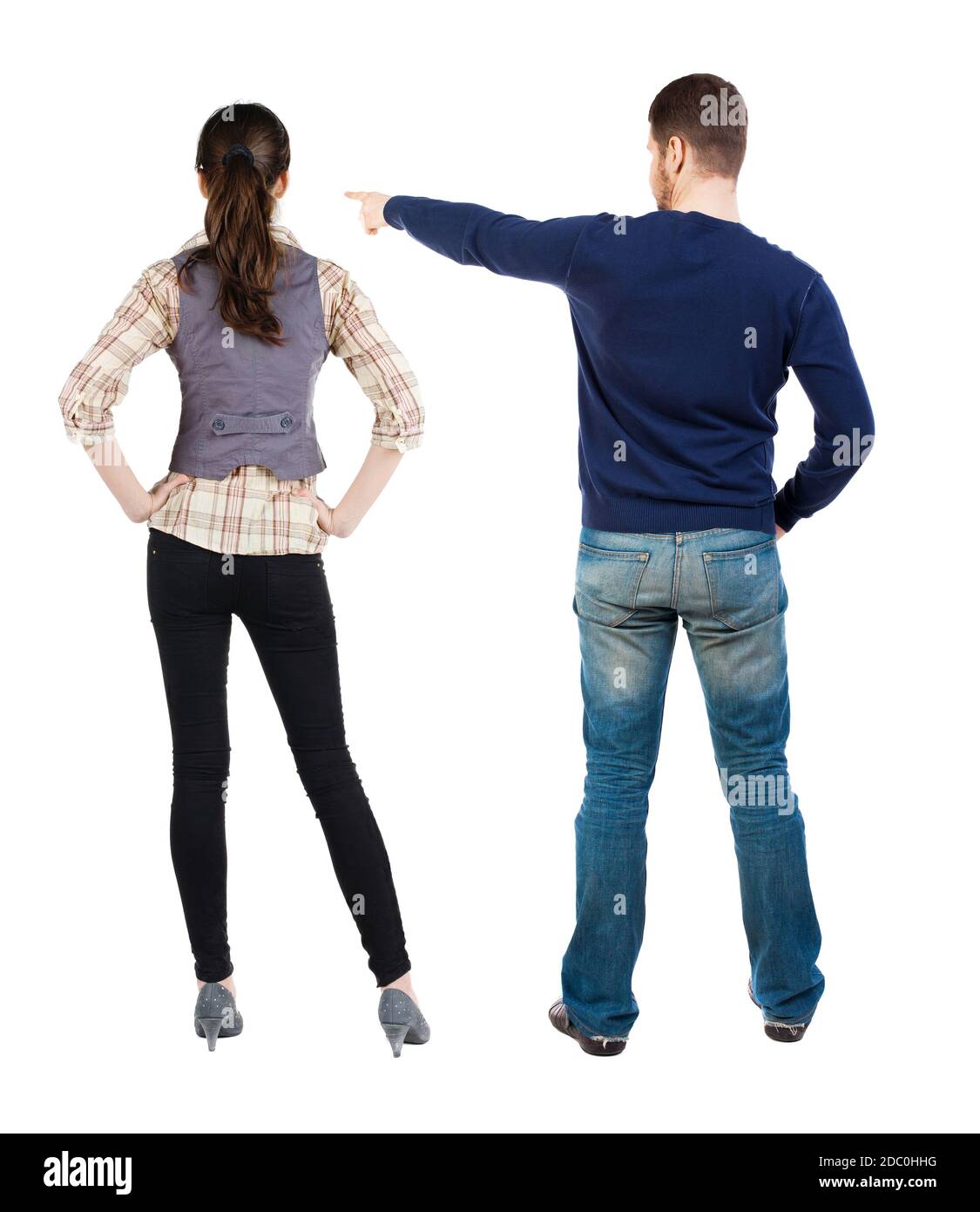 Back view of couple in sweater pointing. Rear view people collection ...