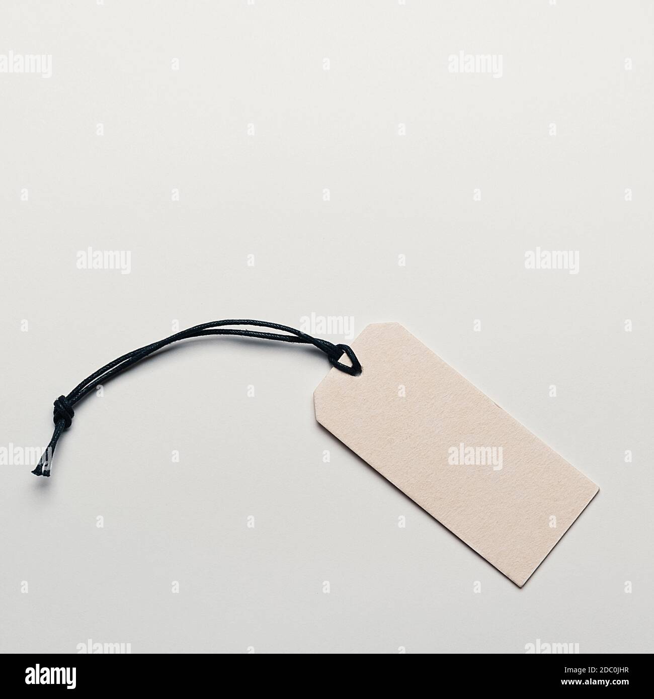 The price tag made of cardboard is empty without inscriptions on a ...