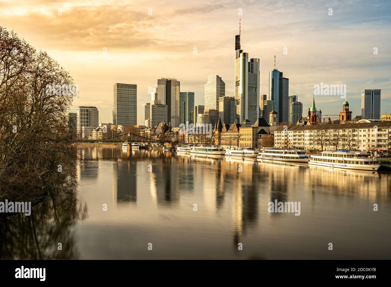 frankfurt skyline at sunset with reflections in the main river ...