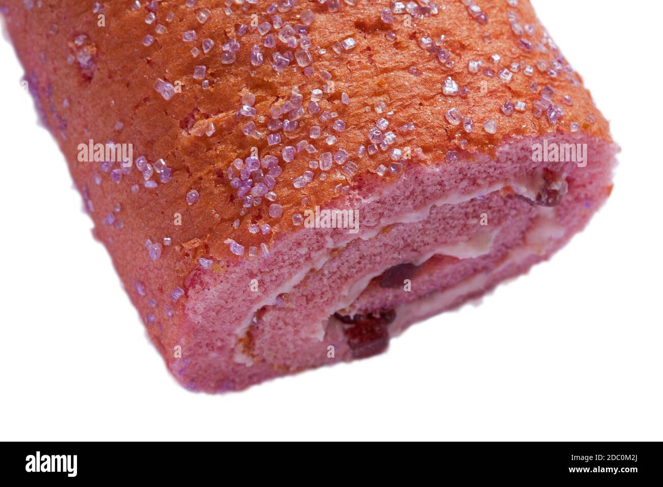 M&S Percy Pig sponge roll cake set on white background - pink sponge ...