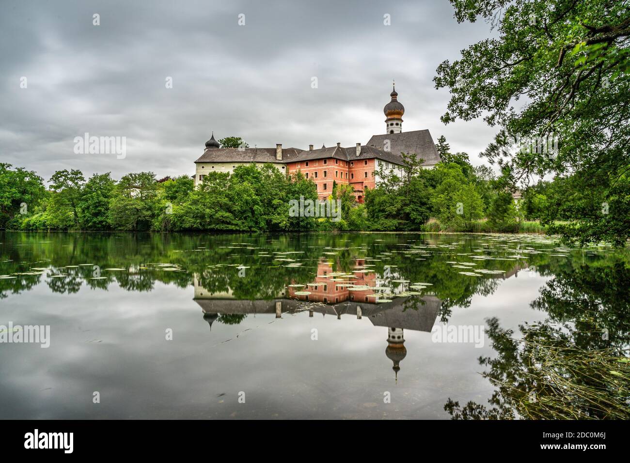 hoeglwoerth abbey and its reflection in the lake near anger in bavaria ...