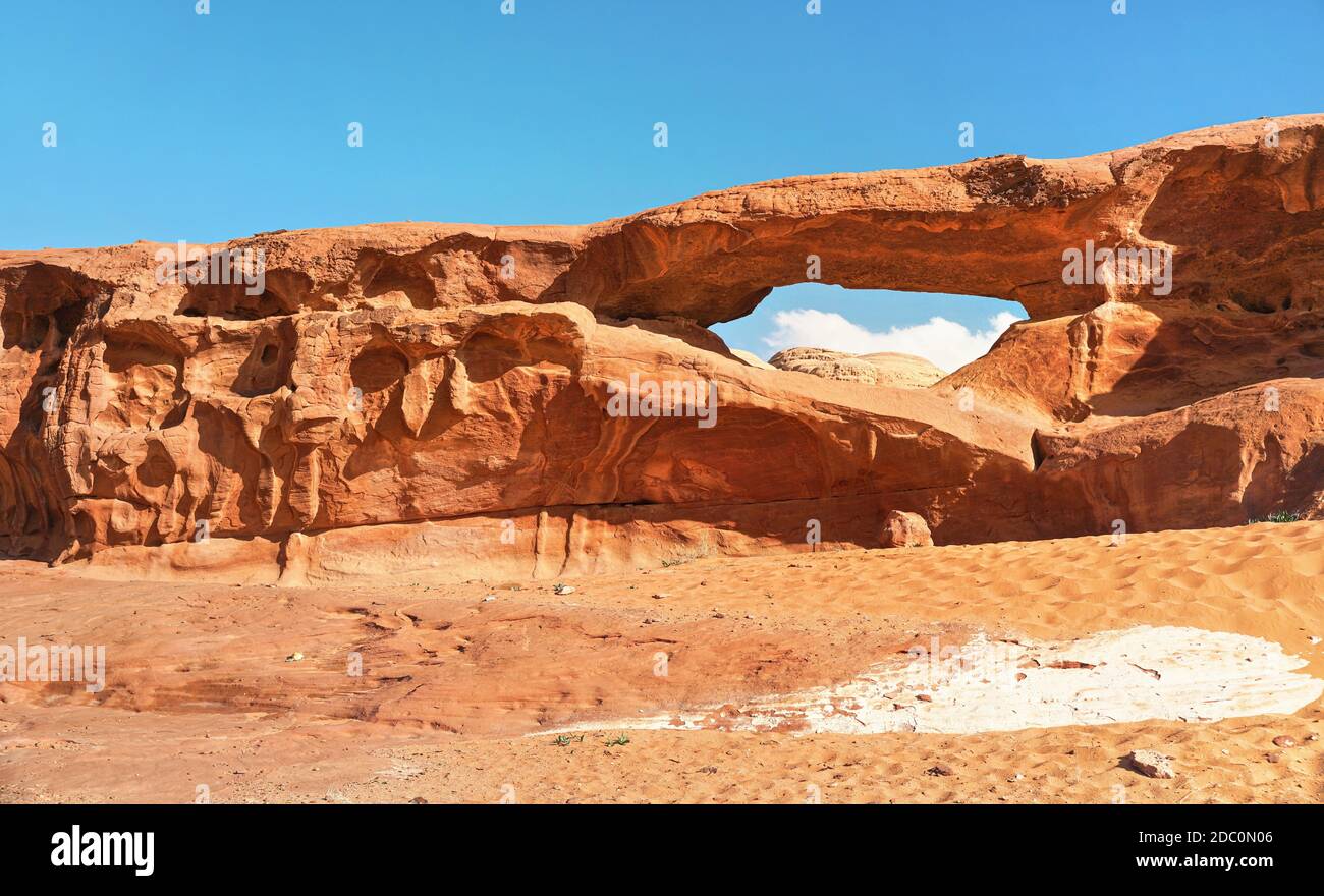 Little arc or small rock window formation in Wadi Rum desert, bright ...
