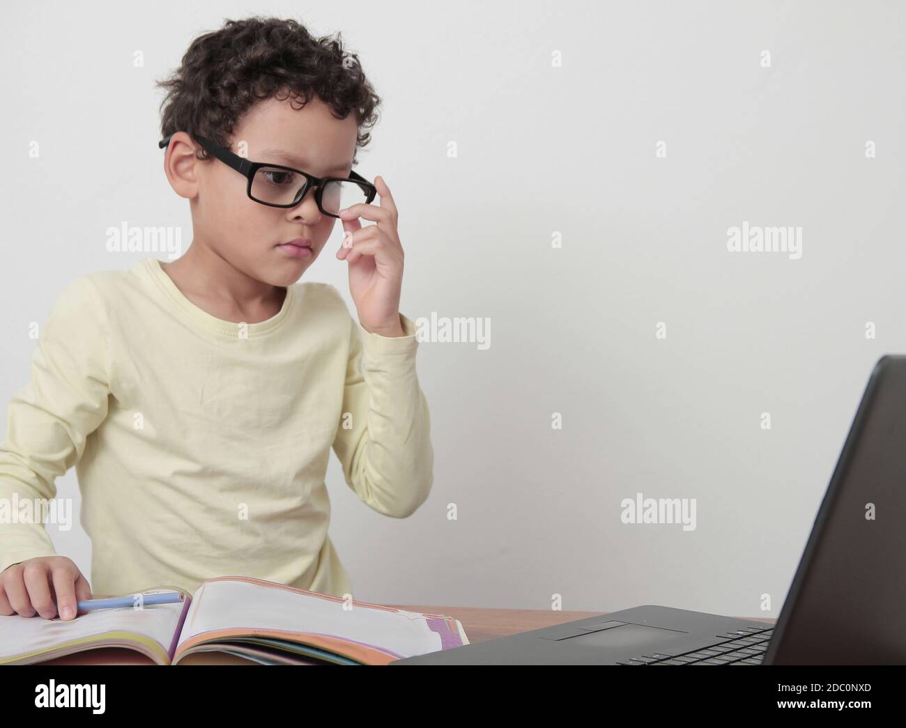 little boy learning at school on white background stock photo Stock ...