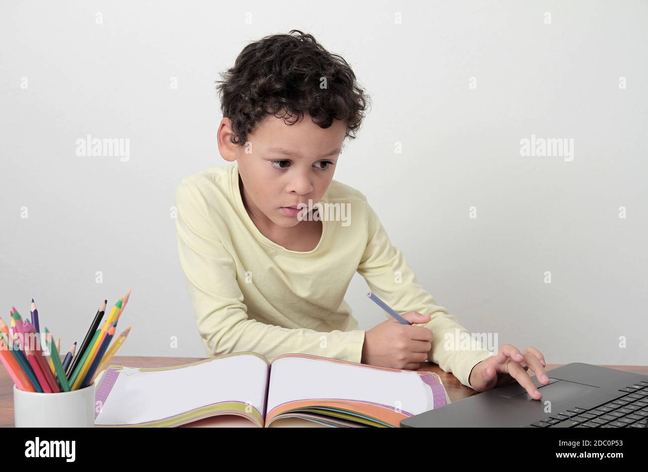 little boy learning at school on white background stock photo Stock ...
