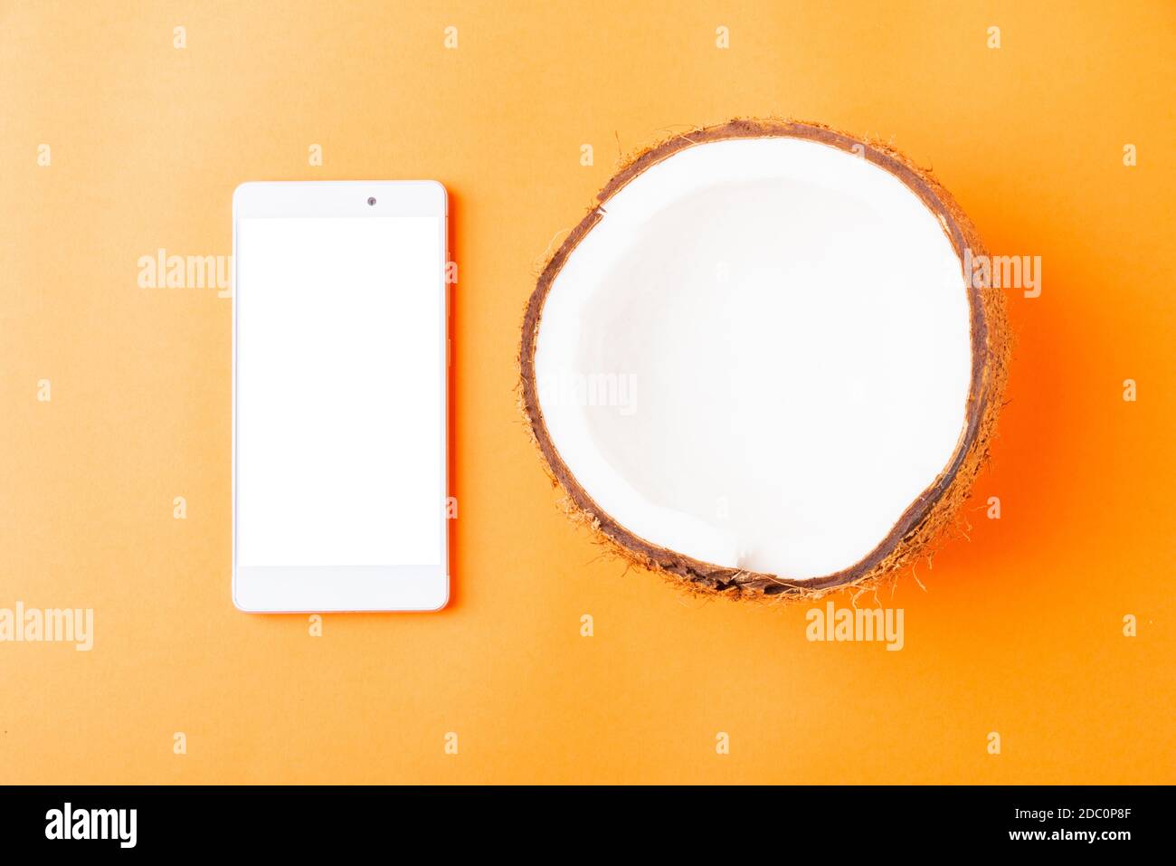 Happy coconuts day concept, fresh half coconut and digital smartphone ...