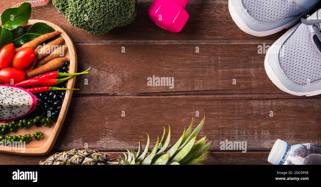 Top view of various fresh organic fruit and vegetable in heart plate ...