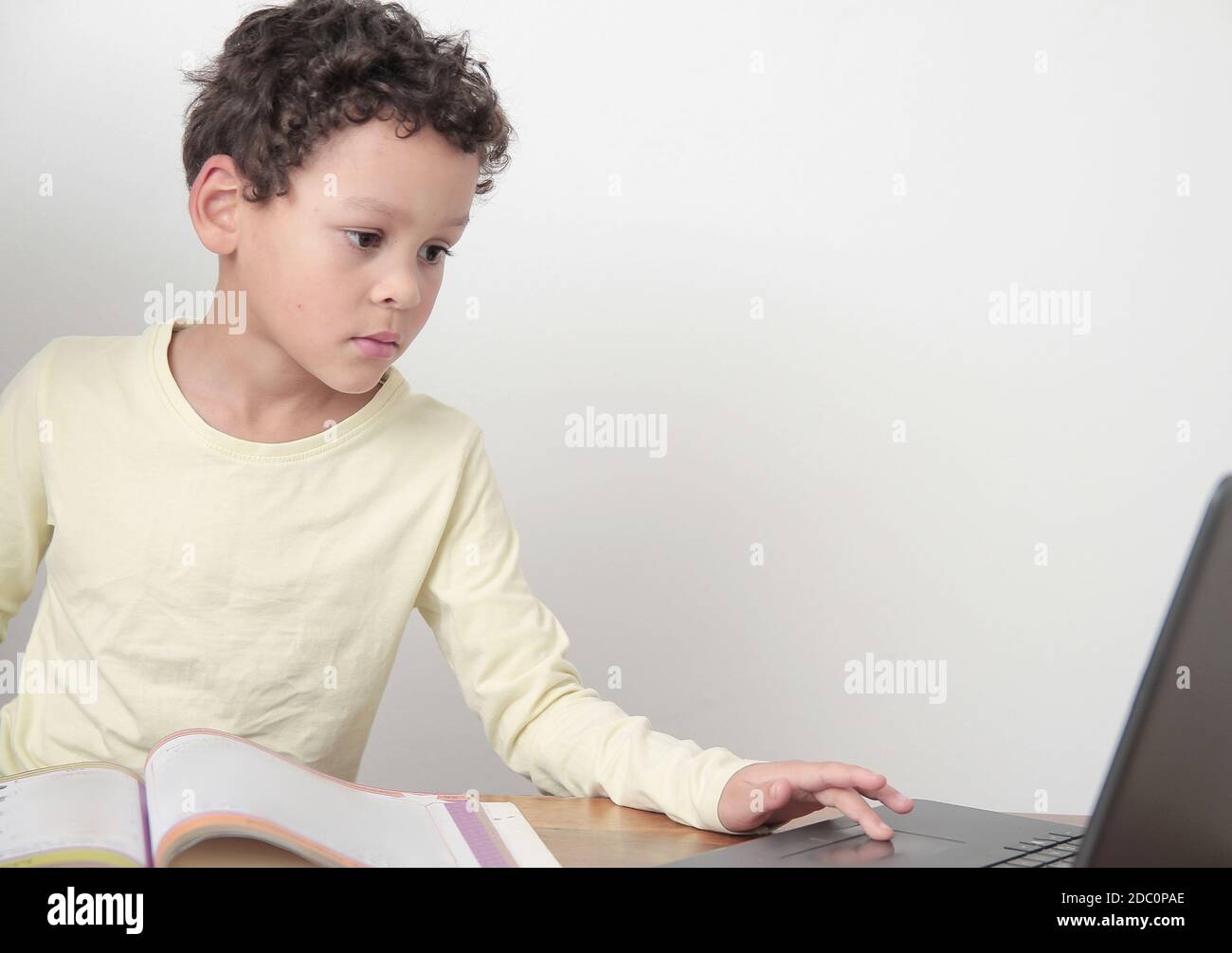 little boy learning at school on white background stock photo Stock ...