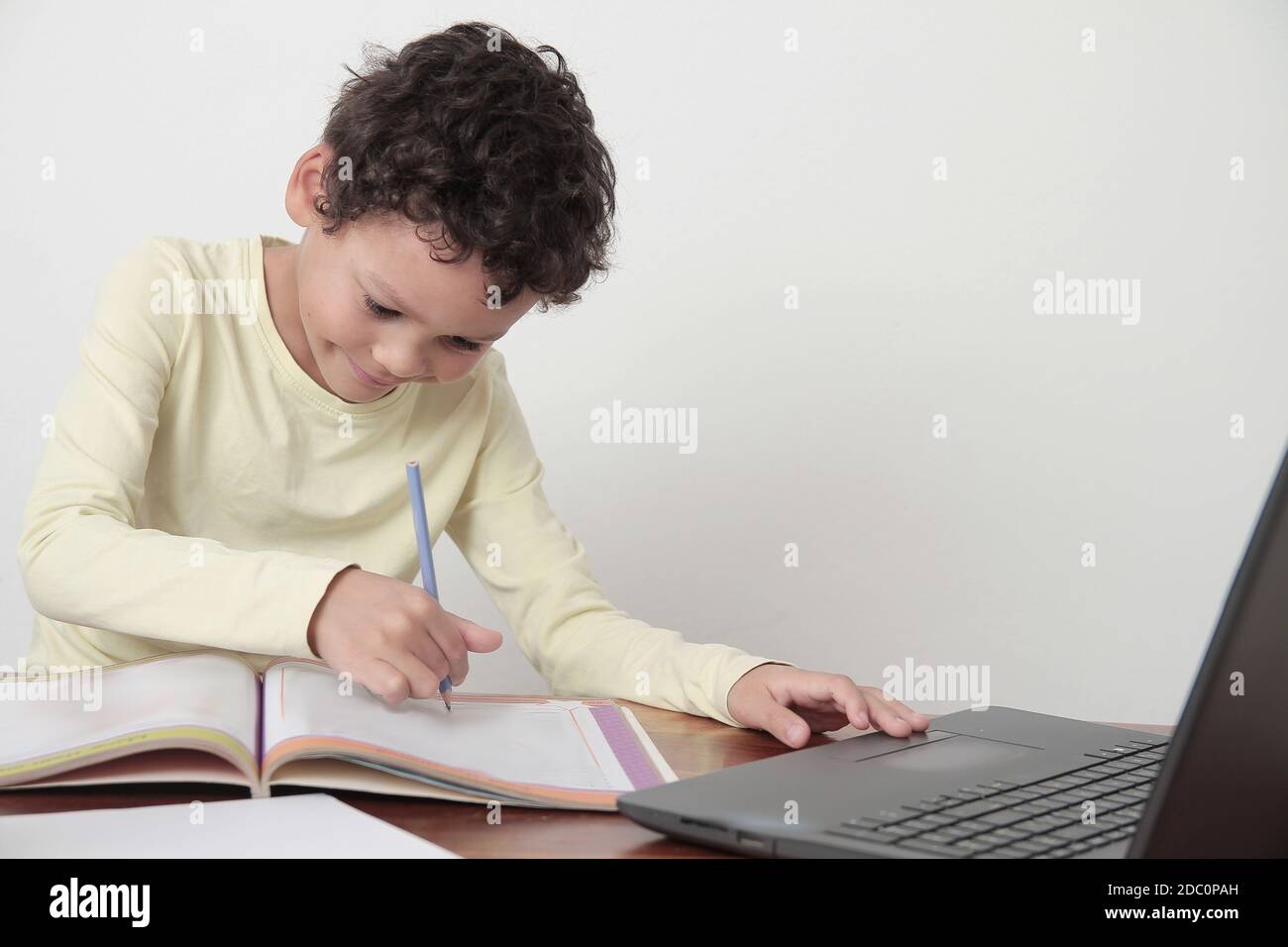 little boy learning at school on white background stock photo Stock ...