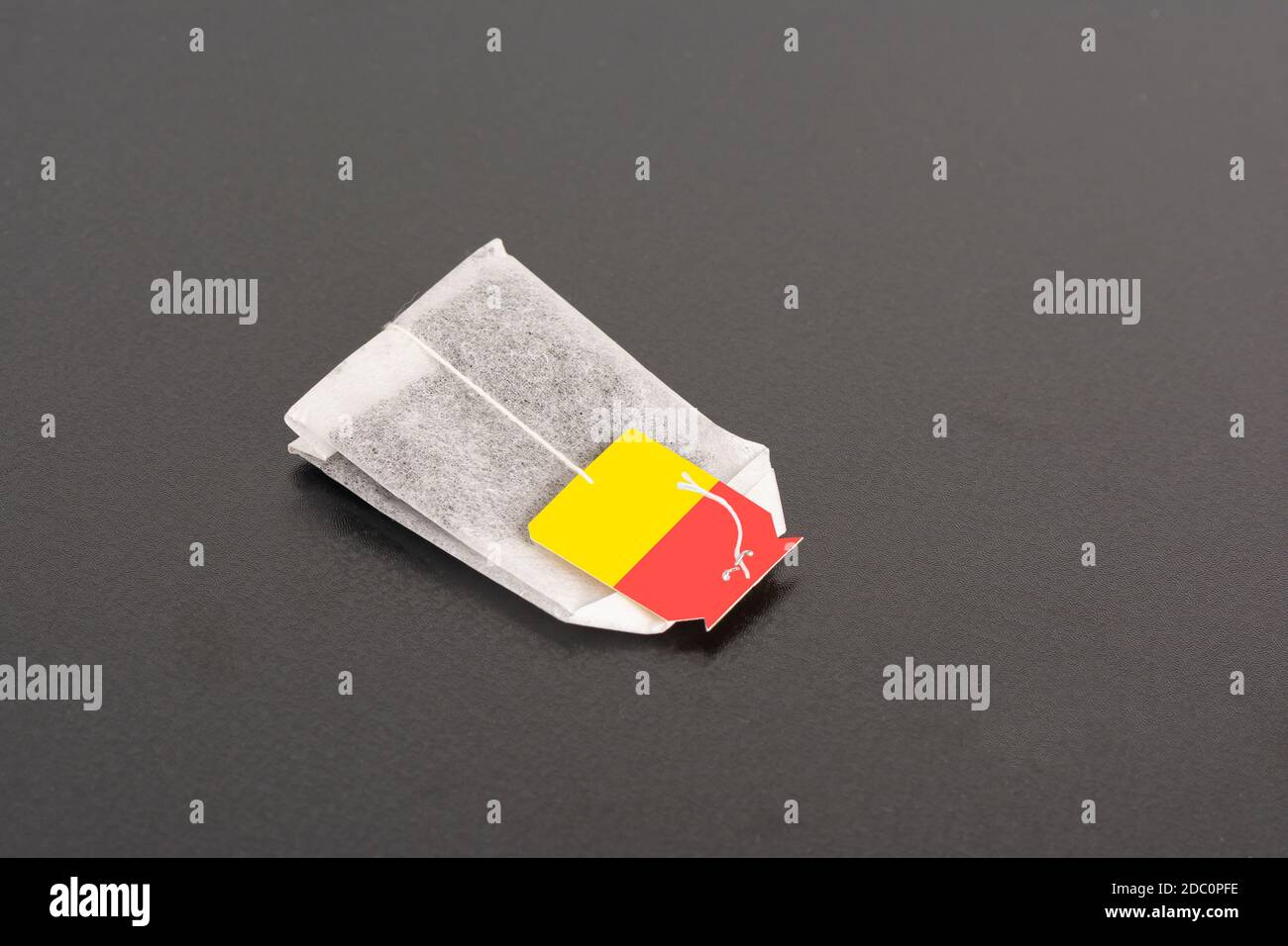 A small tea bag on dark background, editable mock-up series template ...