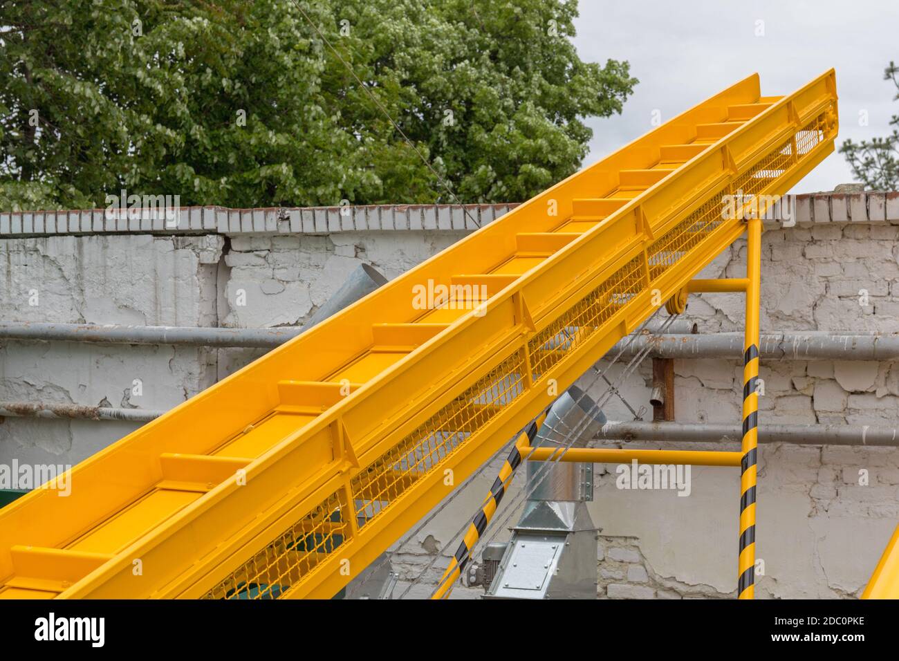 Conveyor Chain for Transport Corncob and Hay Bales Stock Photo - Alamy