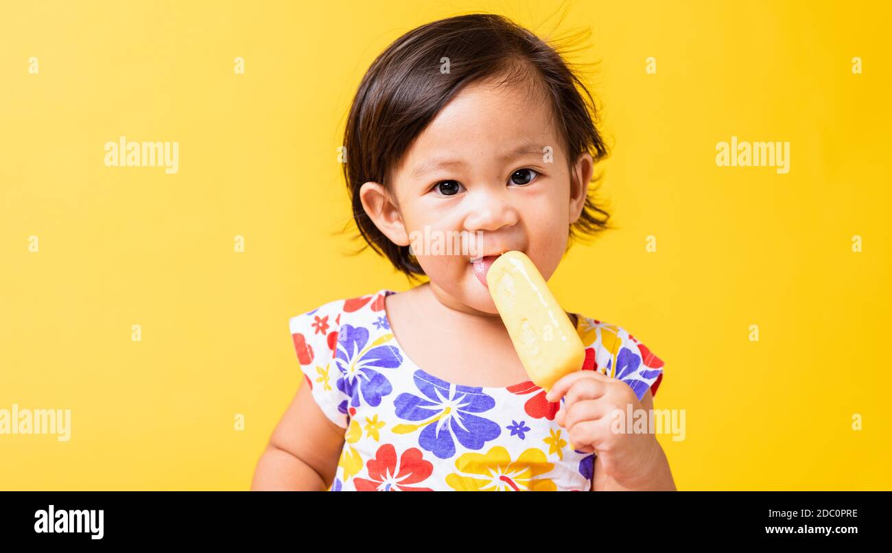 Happy portrait Asian baby or kid cute little girl attractive laugh smile wearing dick pattern ...