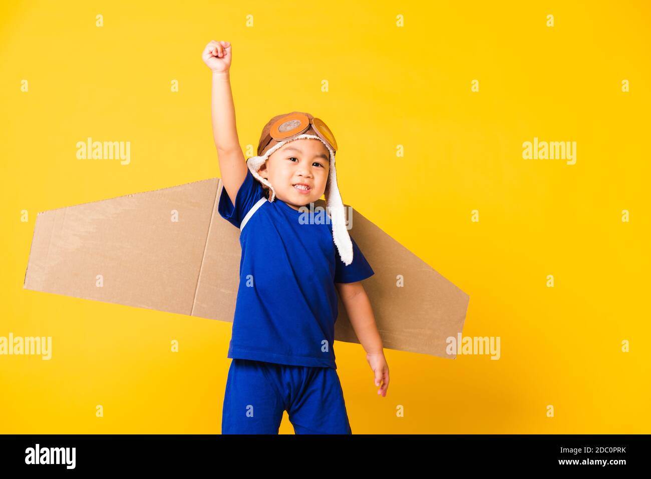 Happy Asian handsome funny child or kid little boy smile wear pilot hat ...