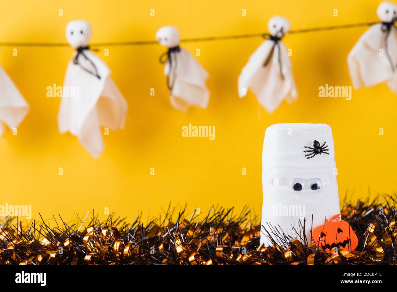 Funny Halloween day decor party concept, The mummy ghost on water glass ...