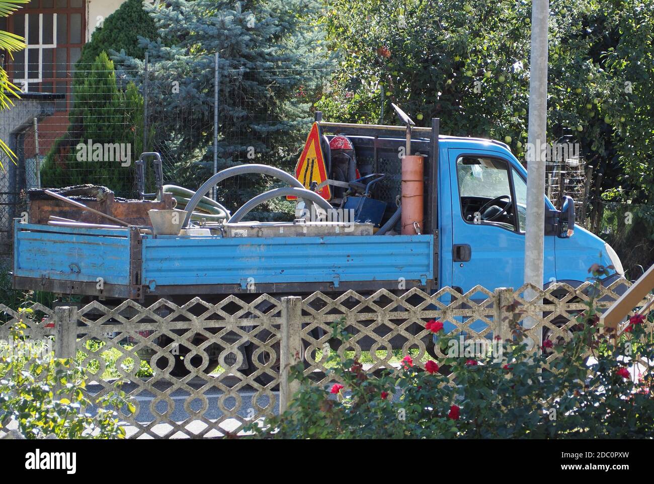 blue road works lorry with tools and traffic signs Stock Photo - Alamy