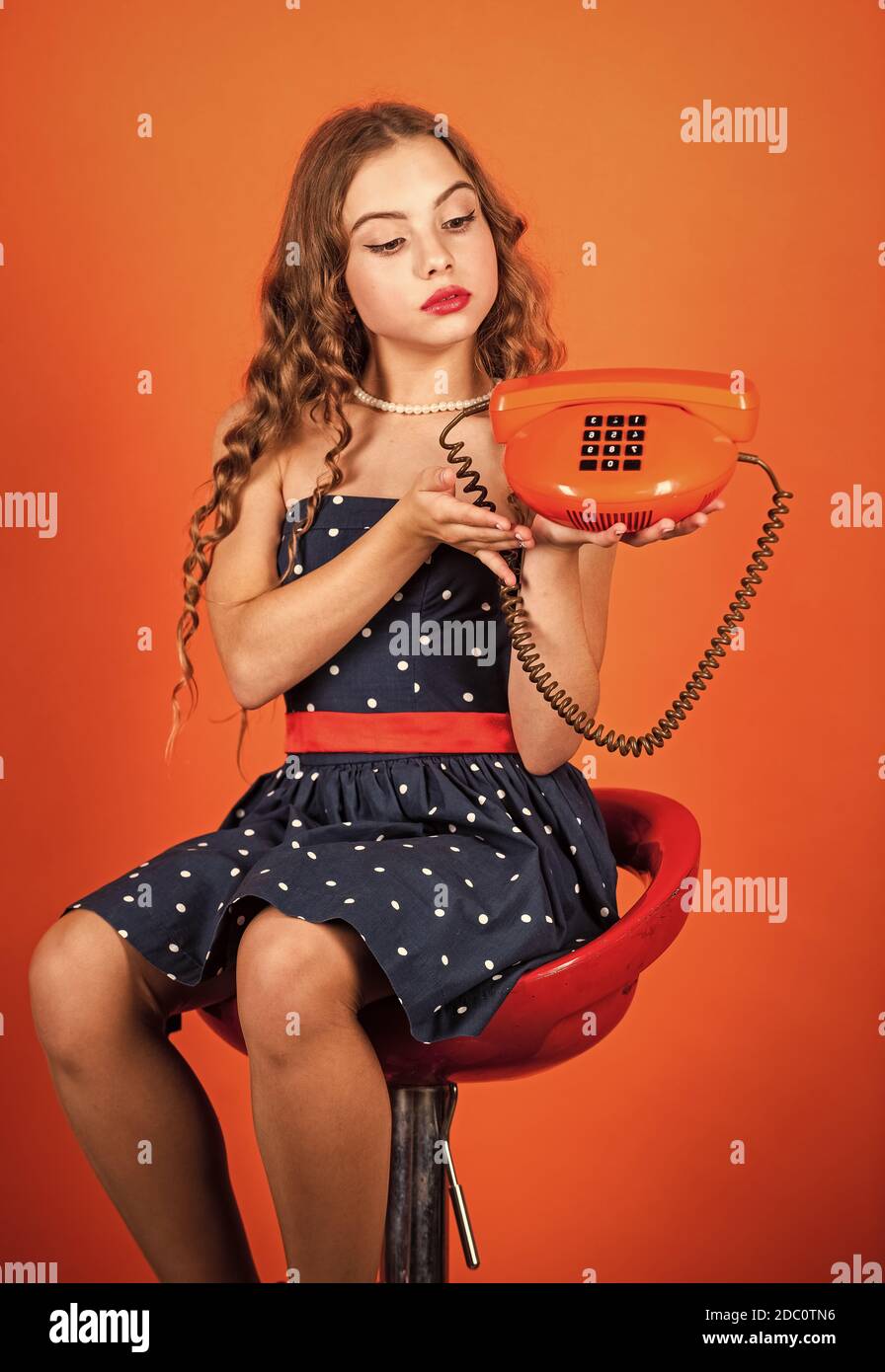 Confident beauty. pinup girl happy conversation. kid sit on chair dial ...