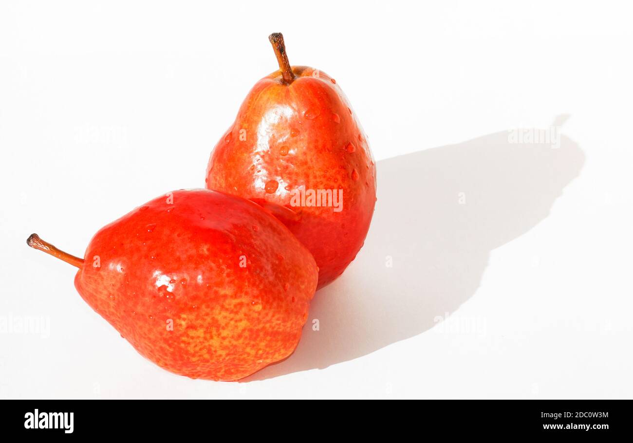 Red orange pears image isolated on white background Stock Photo - Alamy