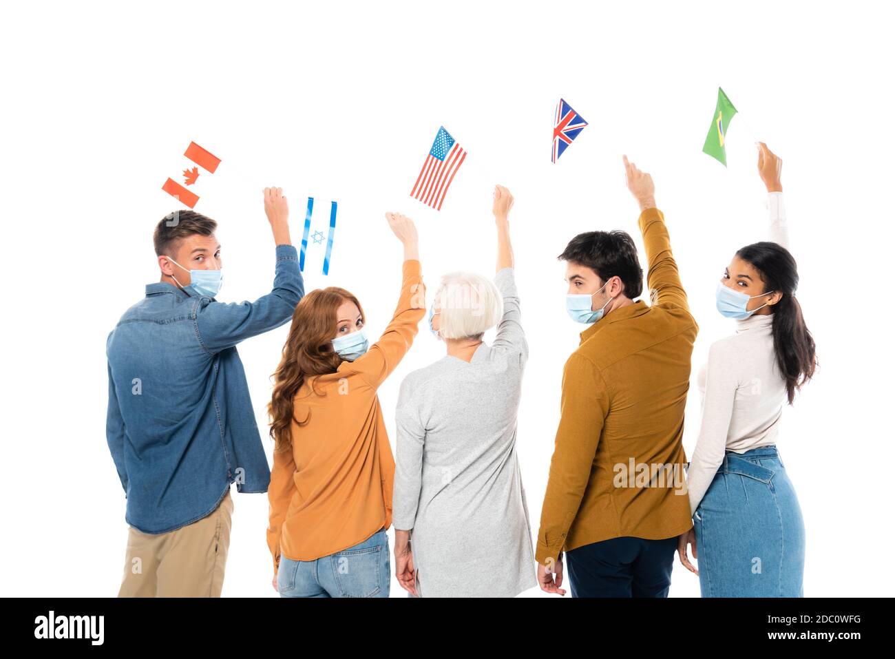 Multiethnic people in medical masks holding flags of countries isolated ...