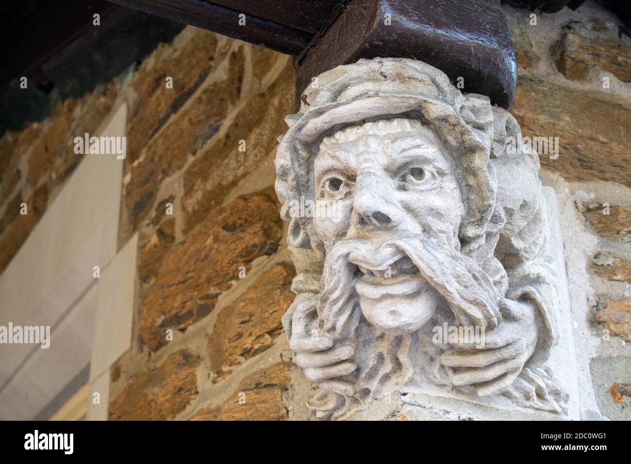 A Creepy Statue Sticking Out of the Cobblestone Wall at the Elkins ...