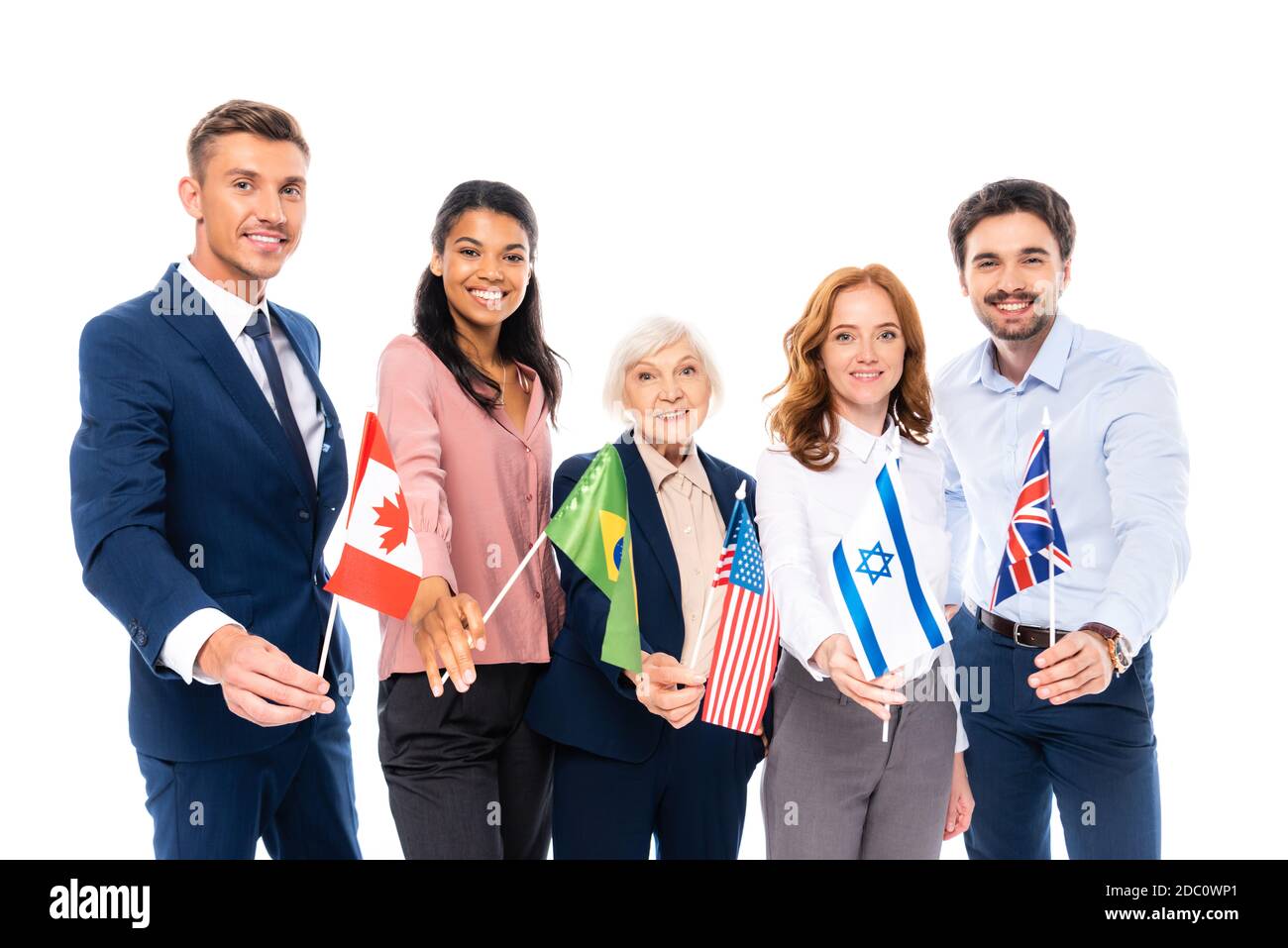 Smiling multiethnic businesspeople holding flags of countries isolated ...