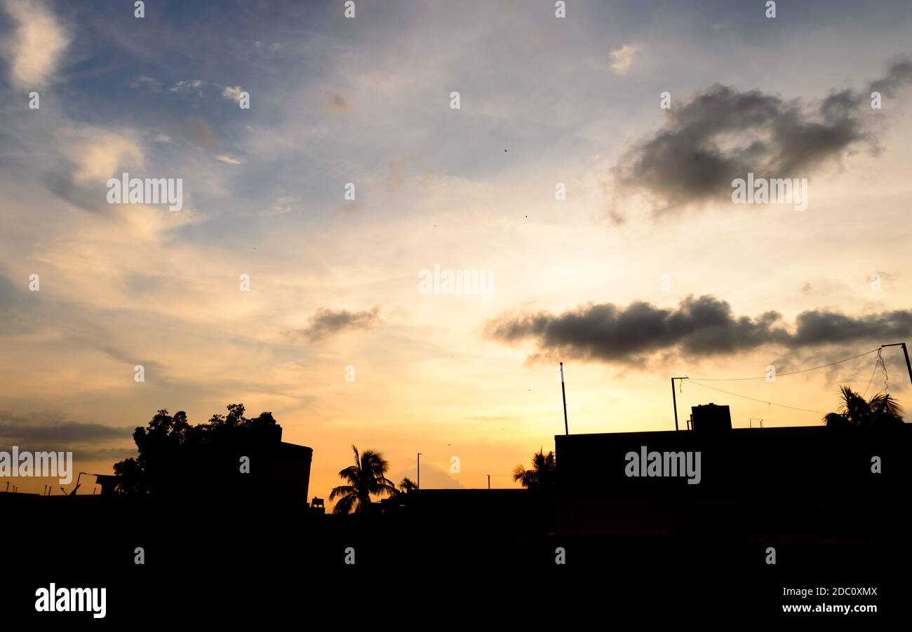 Kolkata city skyline silhouette at sunset. Just before the the Sun goes ...