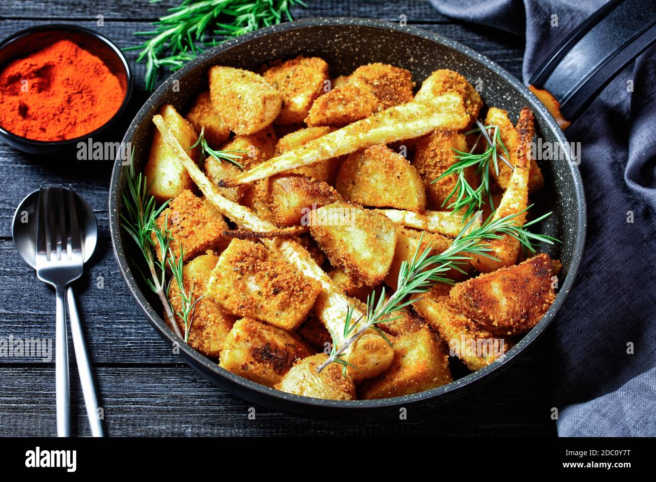 Oven baked root vegetables: parsnip and potato wedges breaded in ...