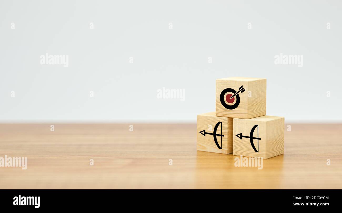 stacked cubes with arrow symbols pointing towards a target on white ...