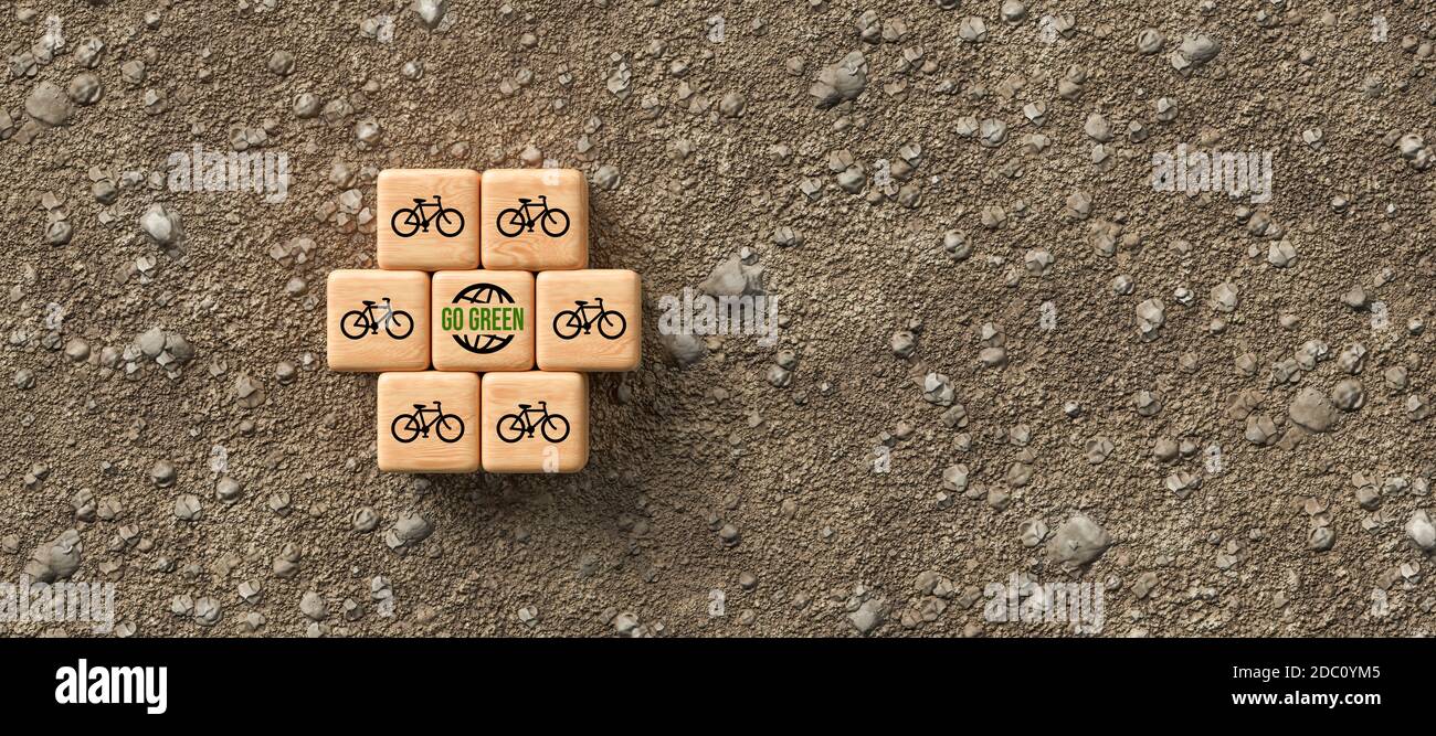 cubes with bike symbols and message GO GREEN on dirt gravel background ...