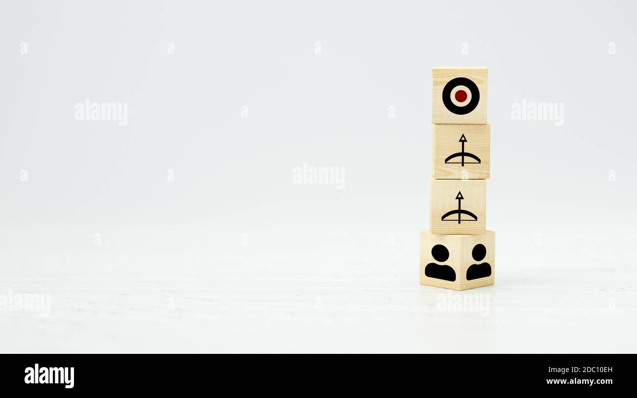 stacked cubes with arrow symbols pointing towards a target on white ...