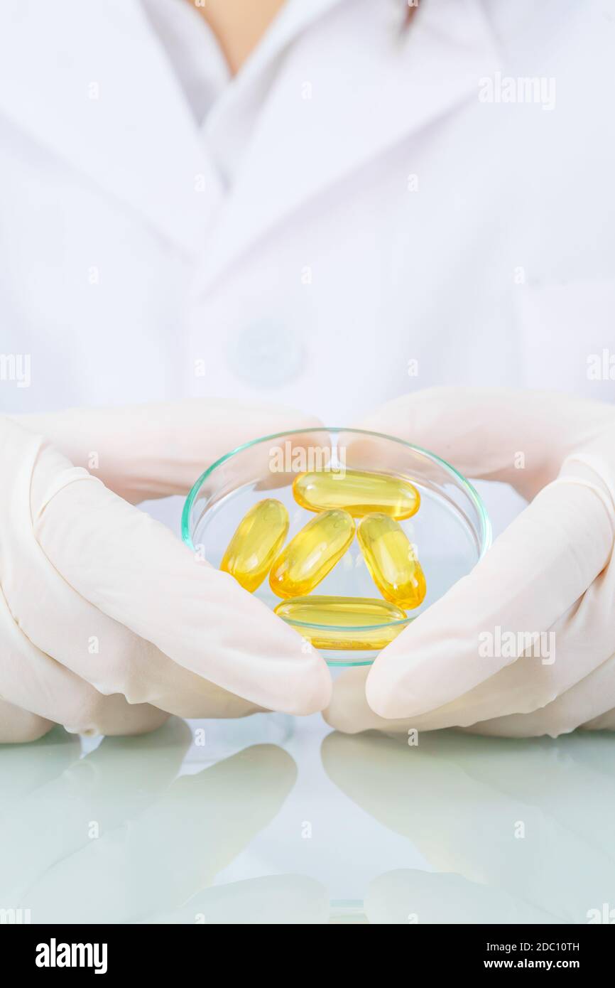 Close up Scientist hands putting in nitrile latex gloves holding Omega ...